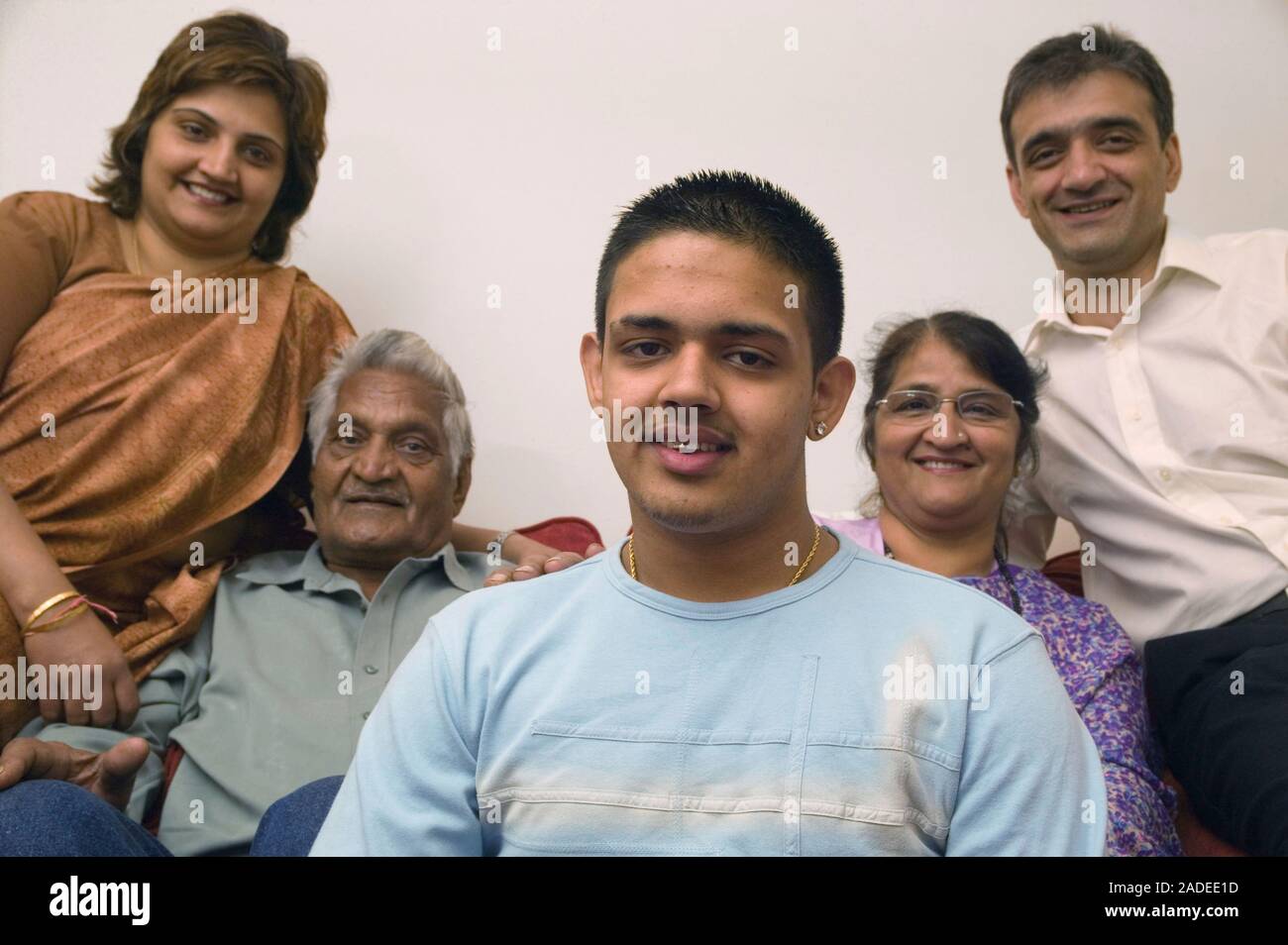 Three generations of family at home together Stock Photo - Alamy