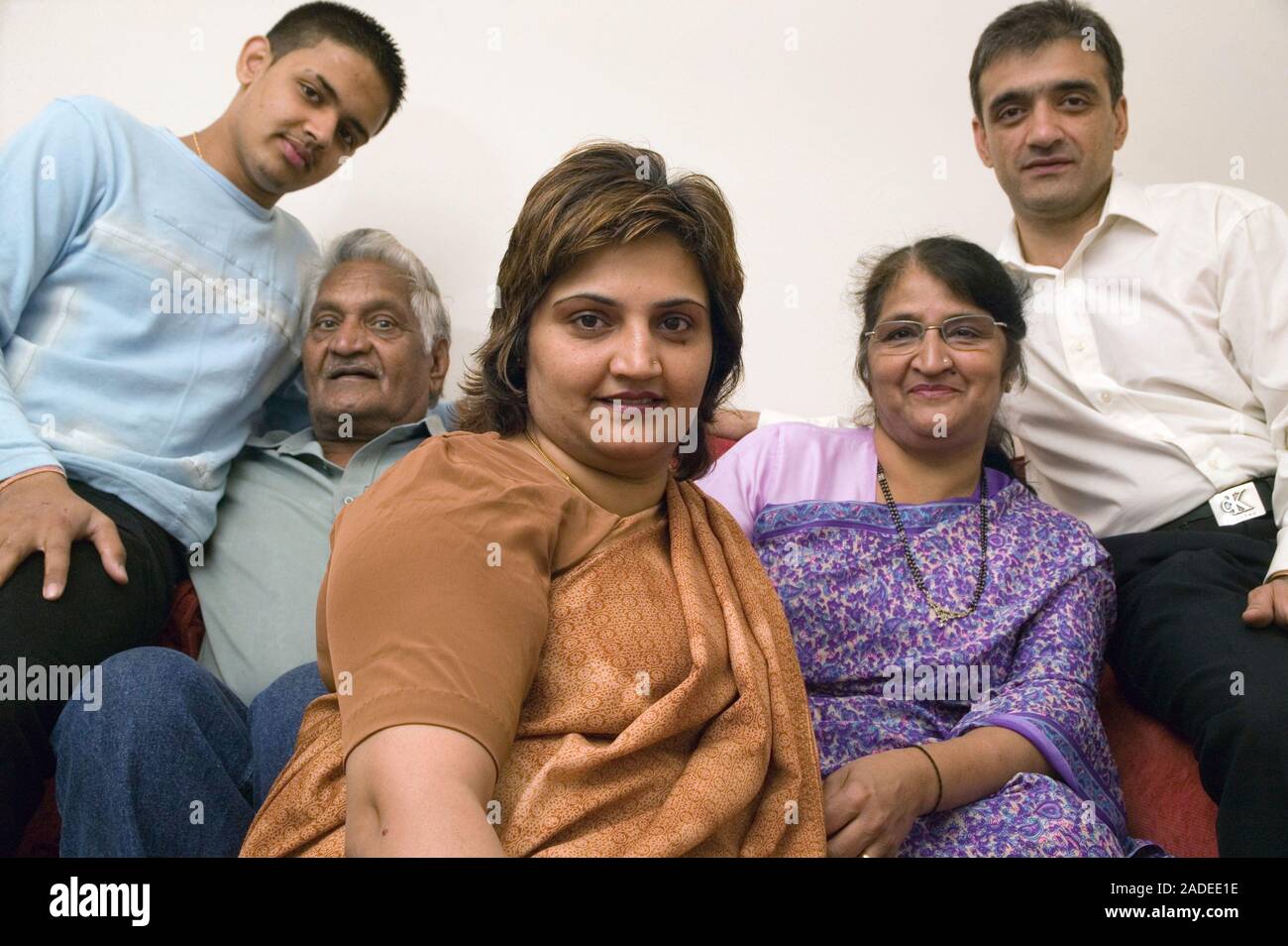 Three generations of family at home together Stock Photo - Alamy