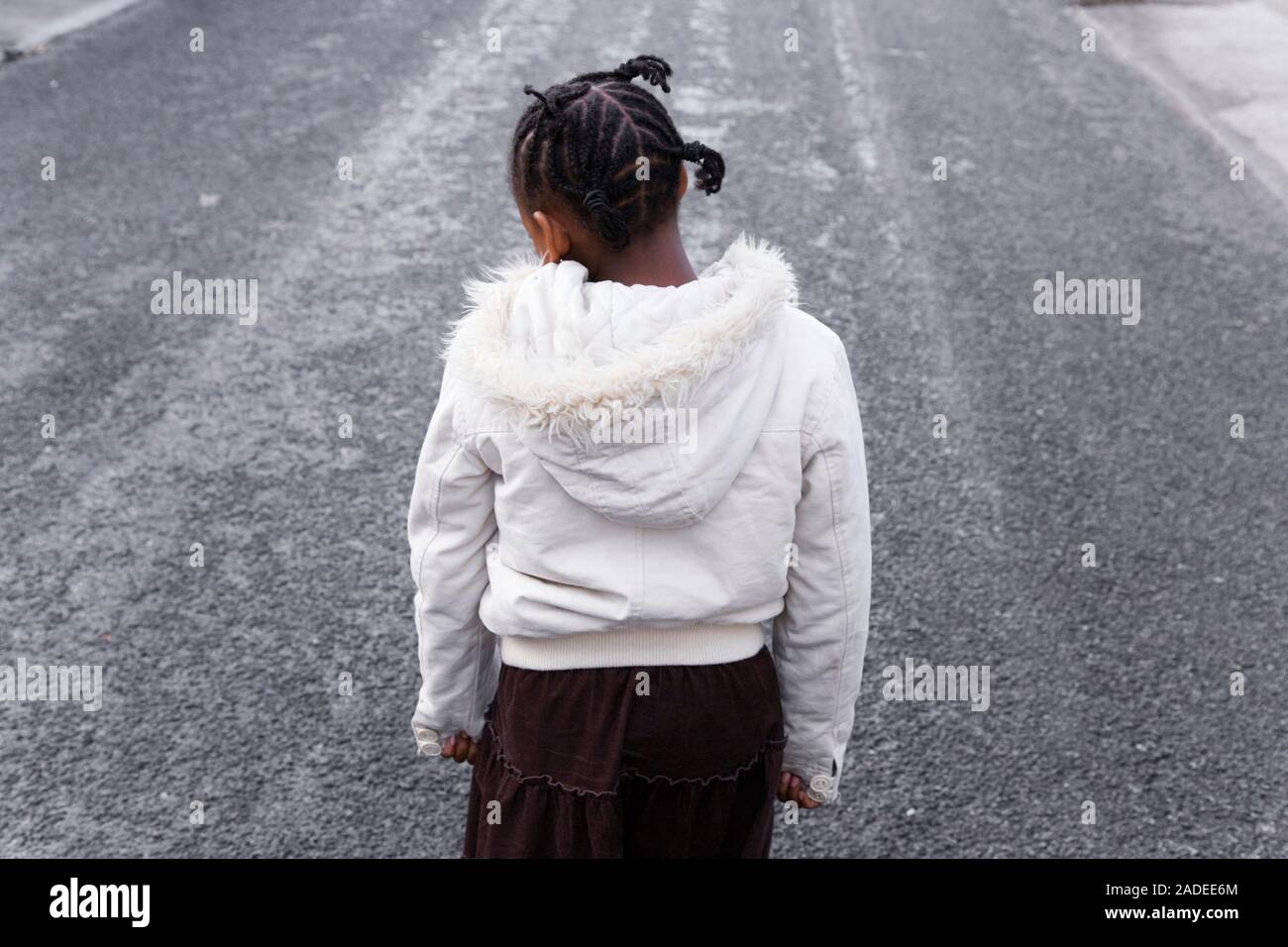 Back view of young girl alone Stock Photo - Alamy
