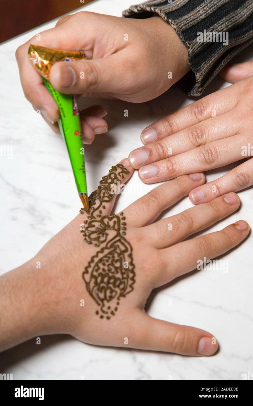Decorating hands with Mehndi at the Nottingham Islamia school Eid Fair ...