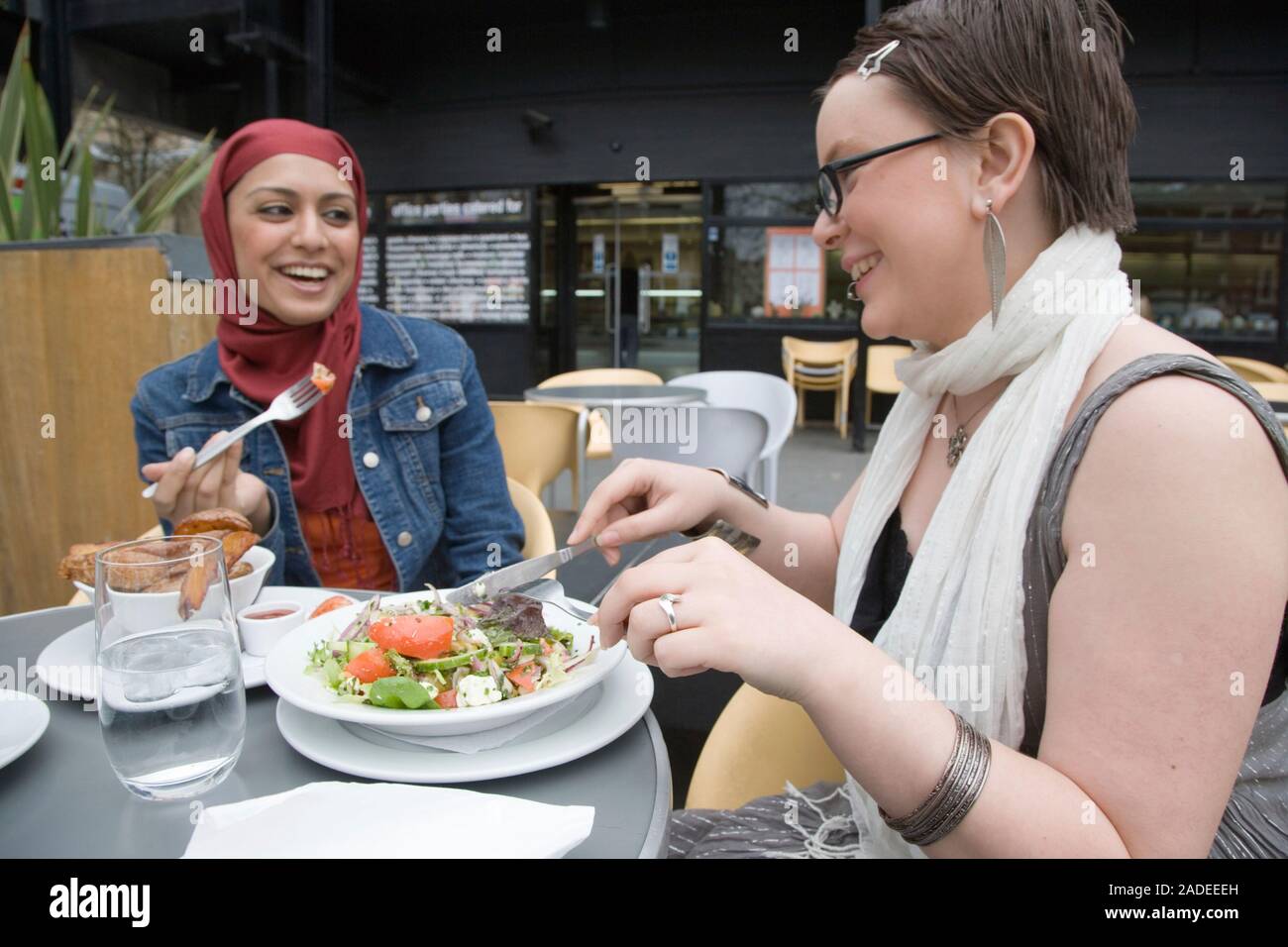 Two students, having a meal together at an outdoor cafe Stock Photo - Alamy