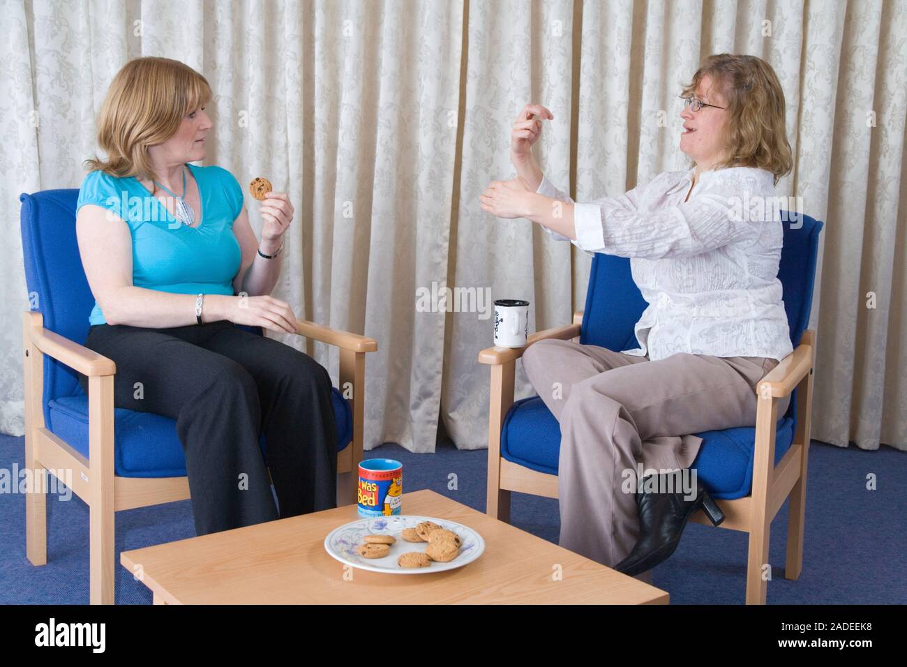 Welfare rights officer and client taking a tea break and signing at The ...