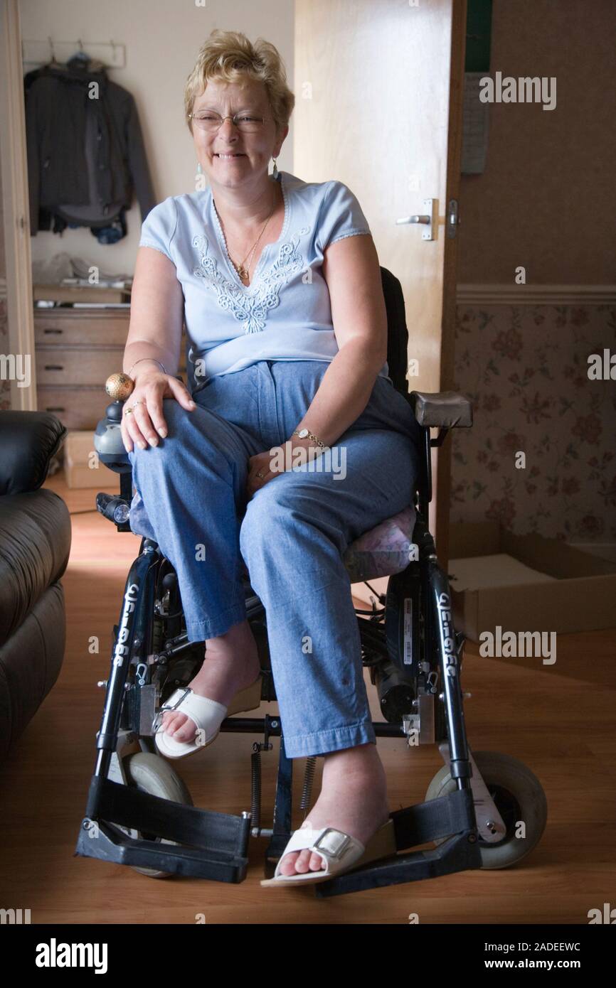 Woman wheelchair user smiling Stock Photo - Alamy
