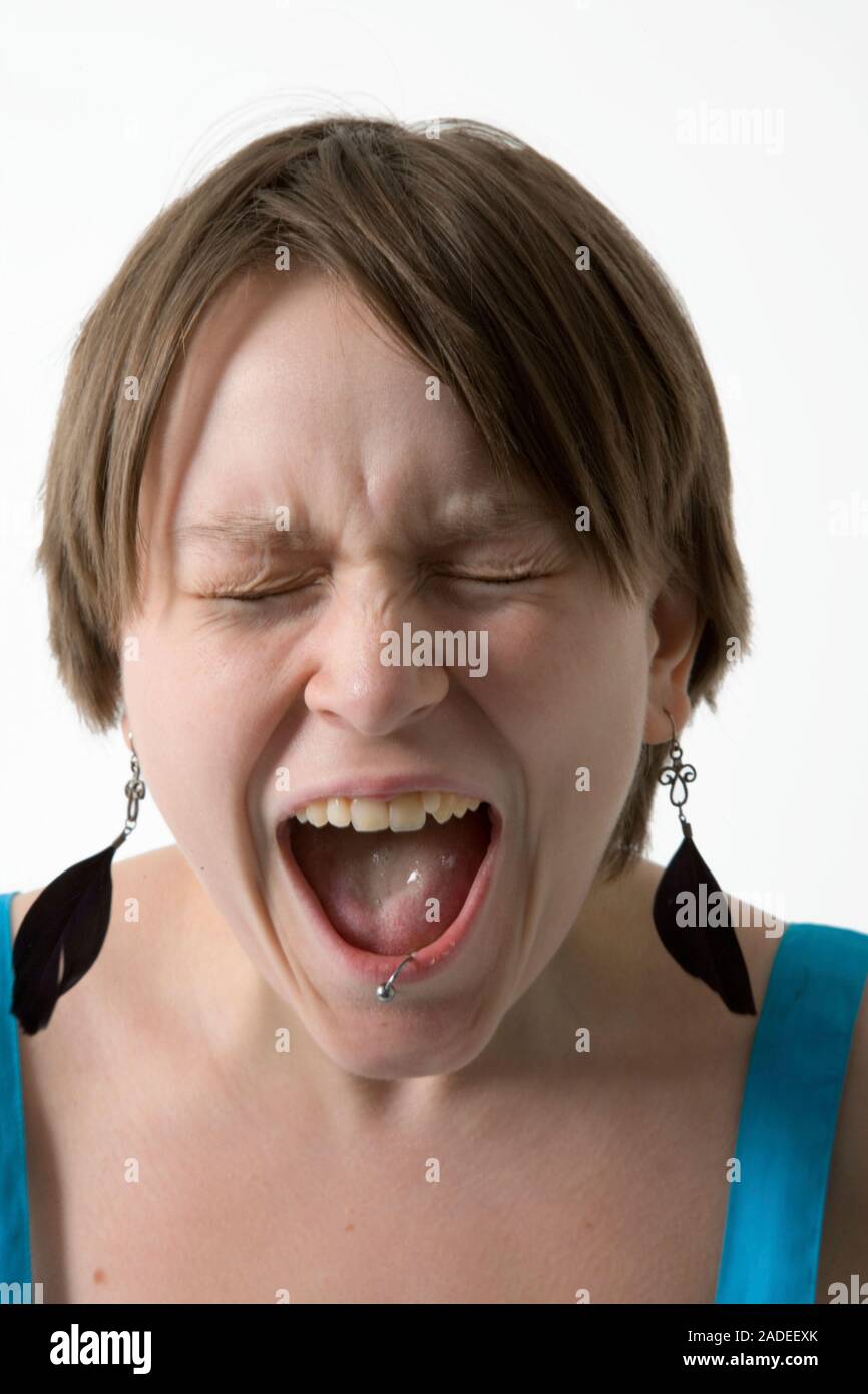 Studio portrait of a teenage girl shouting Stock Photo - Alamy