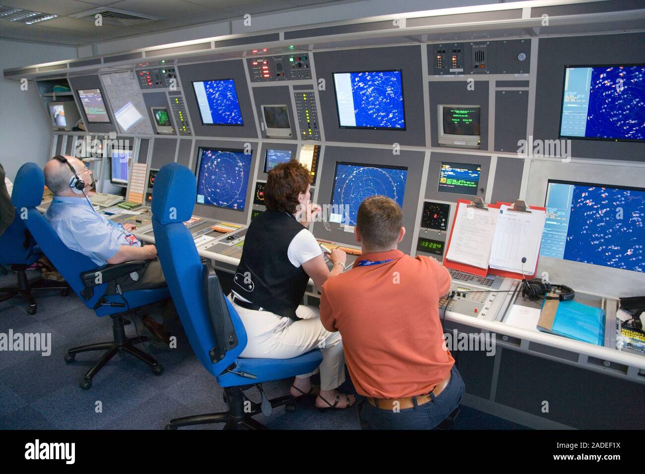Air Traffic Control Tower Operators watching radar screens at East Midlands Airport, UK Stock ...