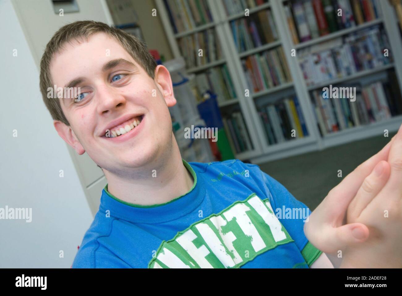 Teenage boy with autism smiling Stock Photo - Alamy