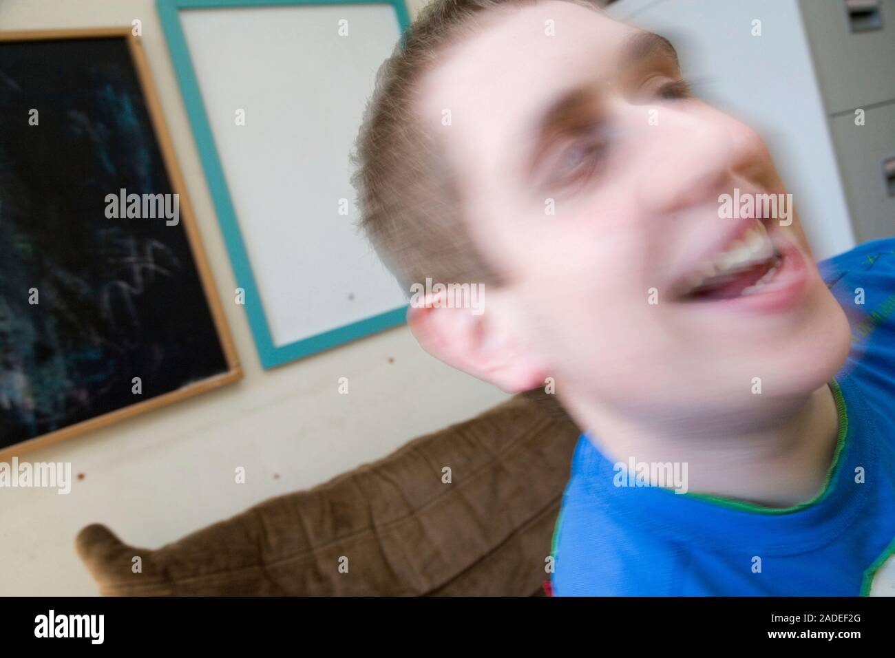 Teenage boy with autism having fun Stock Photo - Alamy