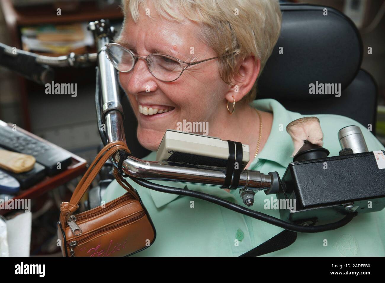 Woman with cerebral palsy with chin-operated wheelchair steering system ...
