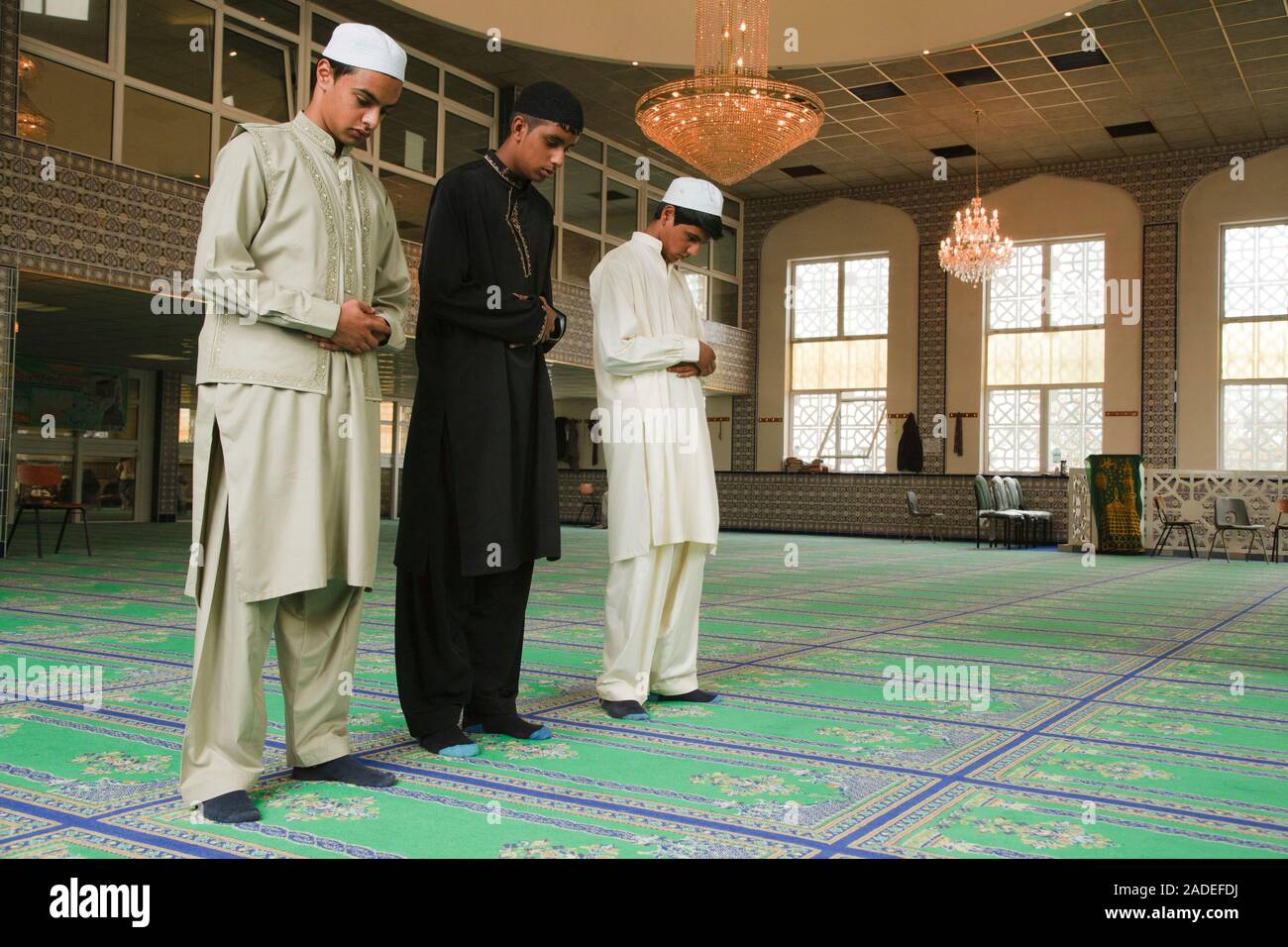 Muslim boys in stages of prayer in a Mosque Stock Photo - Alamy