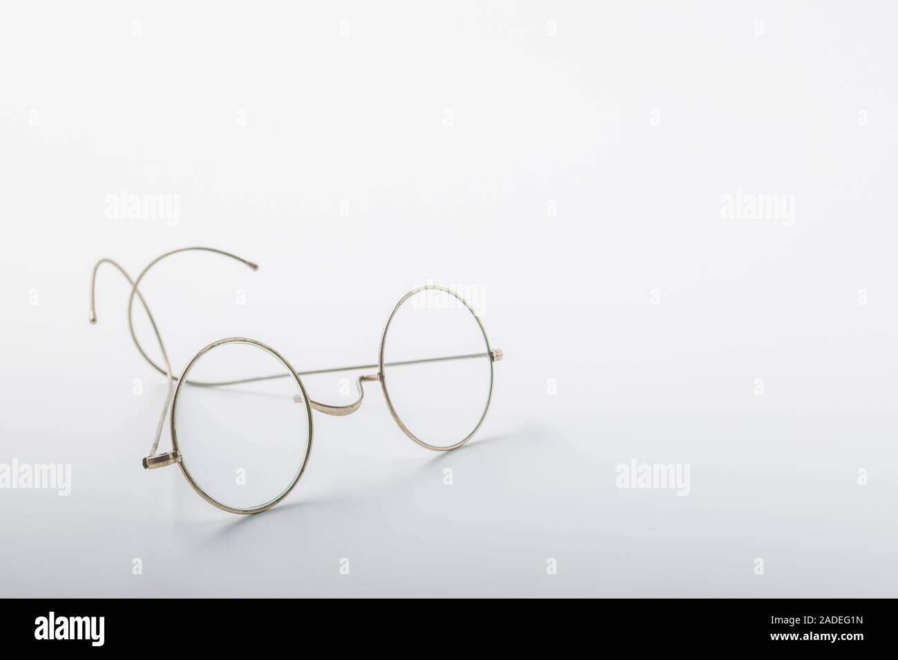 Old metal round framed spectacles Stock Photo - Alamy