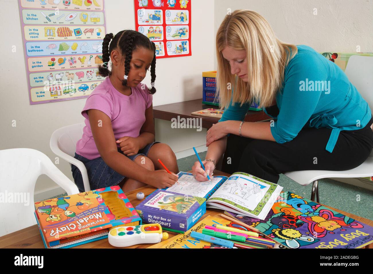 Social worker and child in centre Stock Photo - Alamy