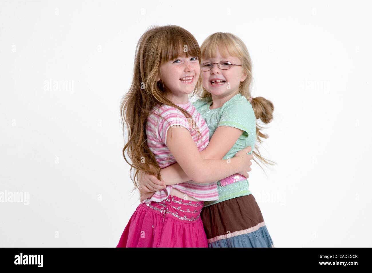 Little girls hugging Stock Photo - Alamy