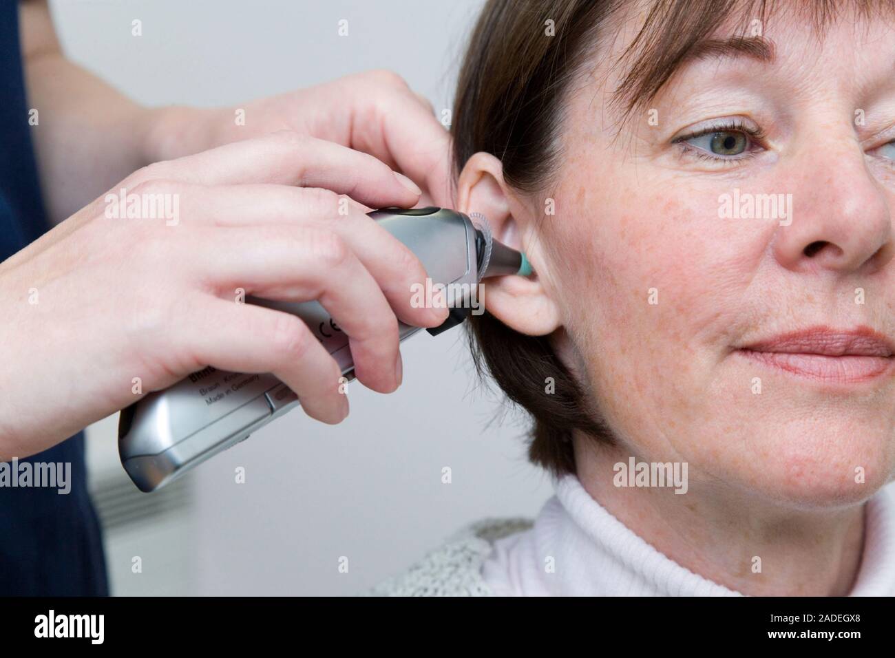 Patient having their temperature taken during a health check up Stock ...