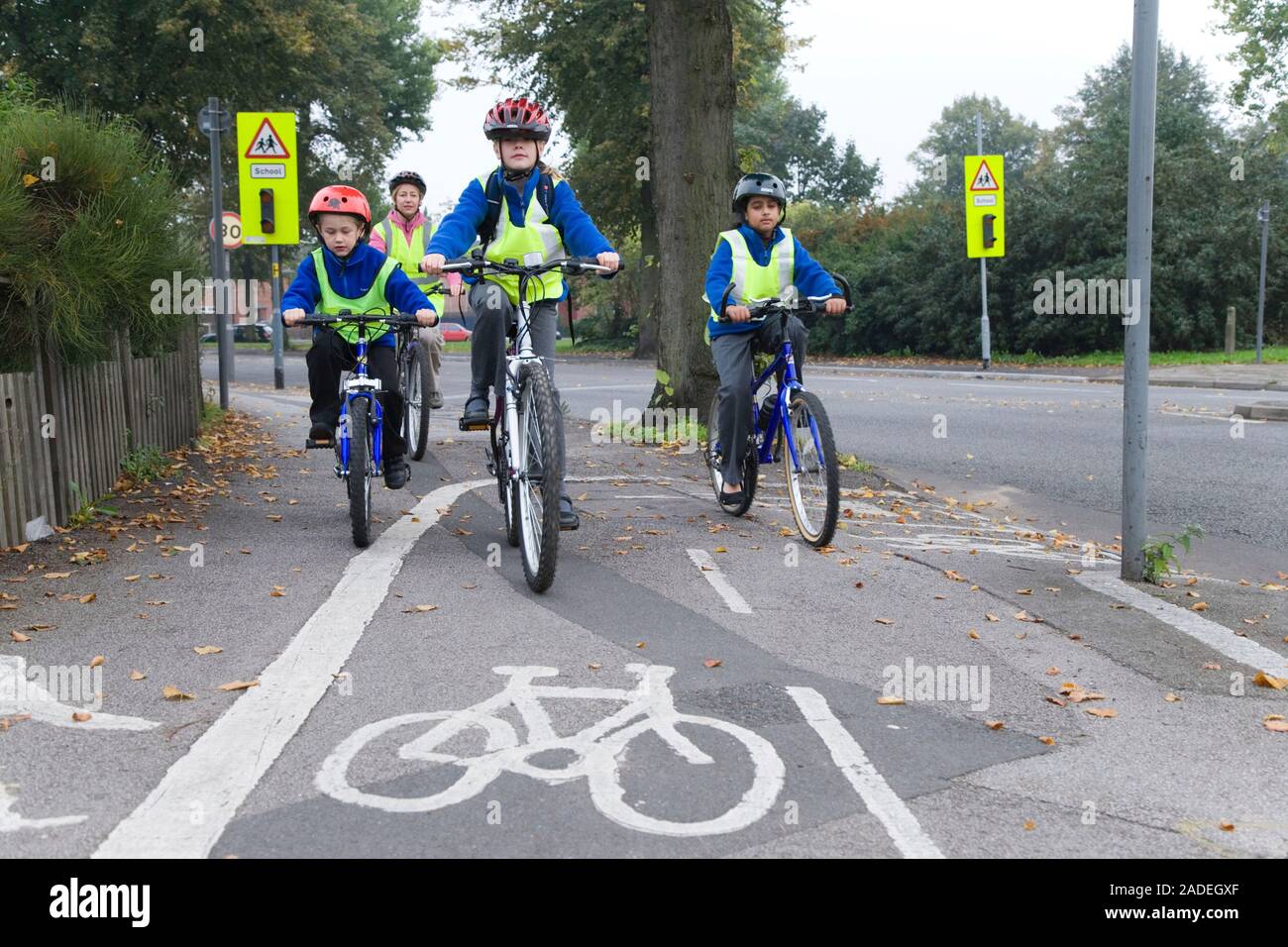 Group of children cycling home from school on a designated cycle path ...