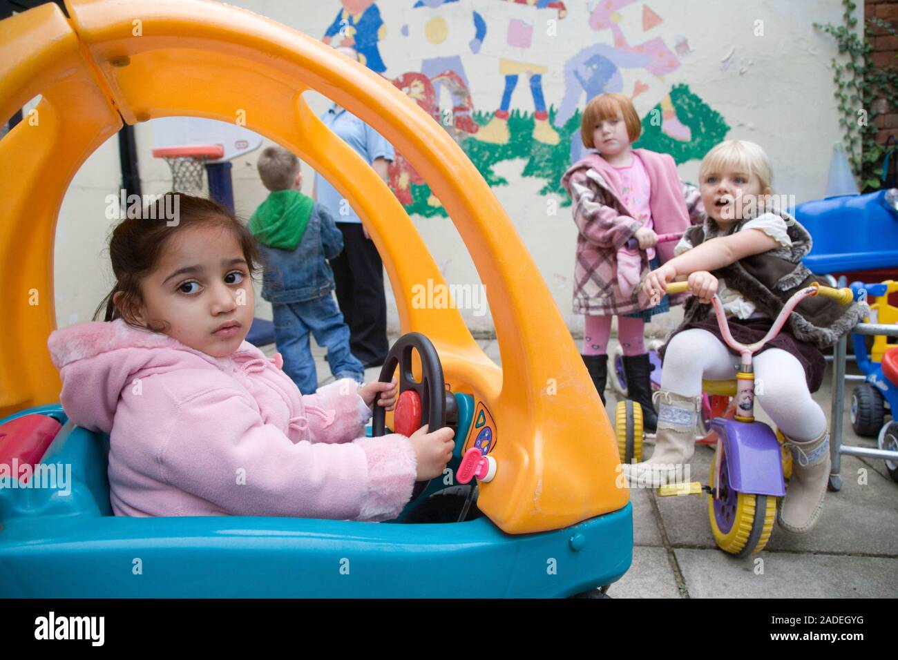 Group of playschool children having fun at breaktime Stock Photo - Alamy