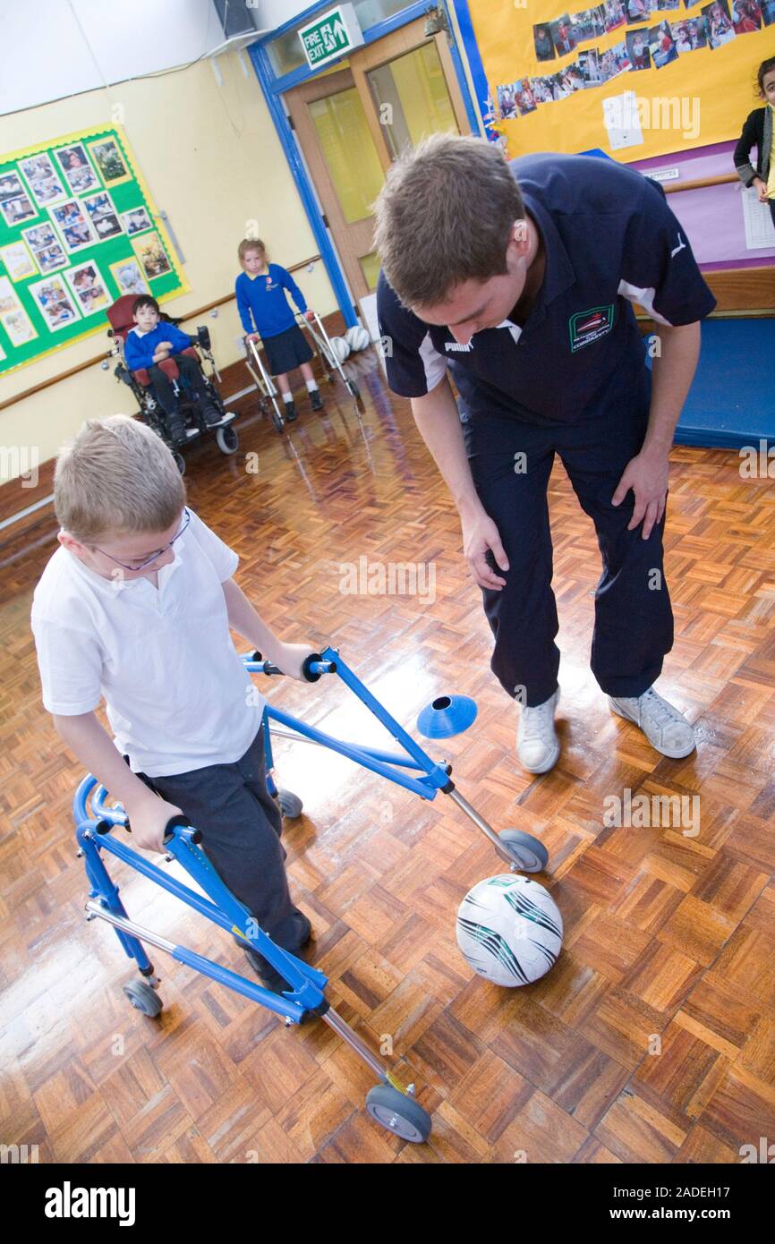 Children with disabilities playing indoor football Stock Photo - Alamy
