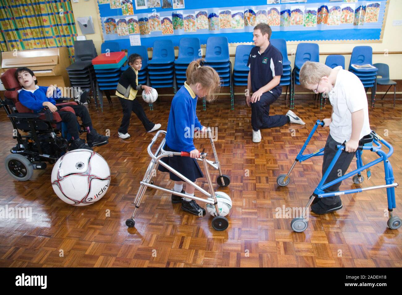 Children with disabilities playing indoor football Stock Photo - Alamy