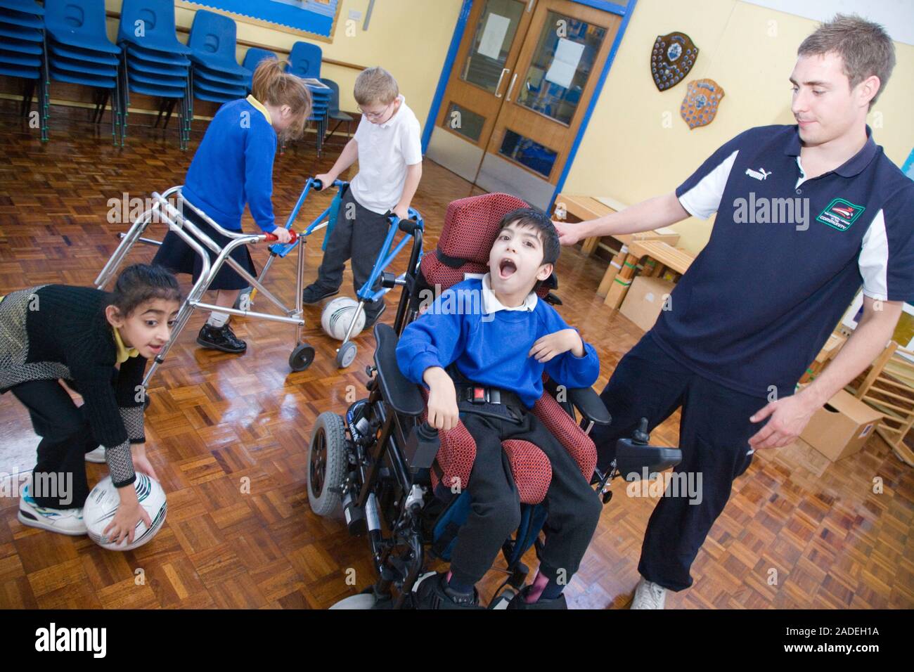 Children with disabilities playing indoor football Stock Photo - Alamy