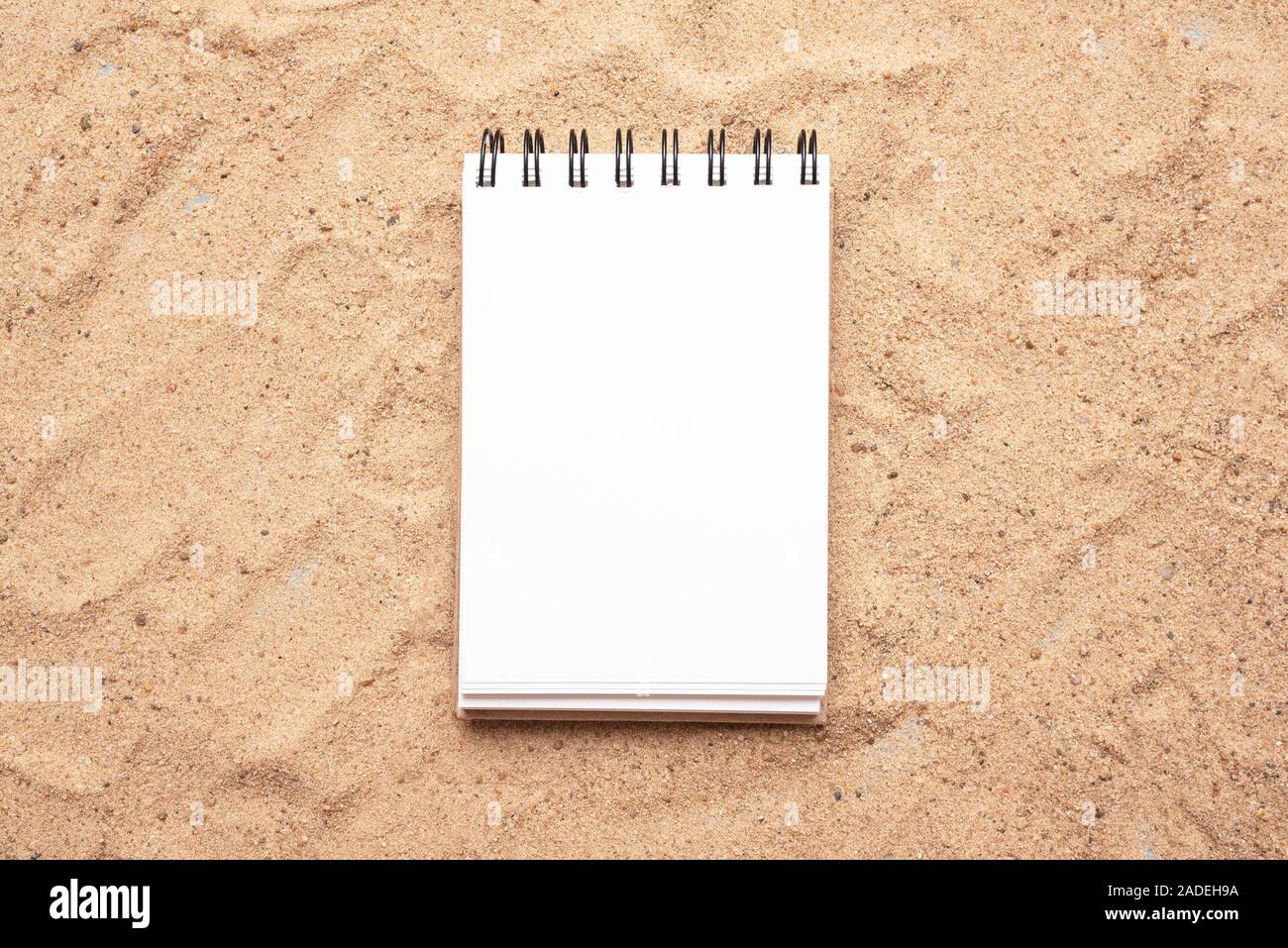 Notepad on the sand flat lay background. Sea vacation diary mockup ...