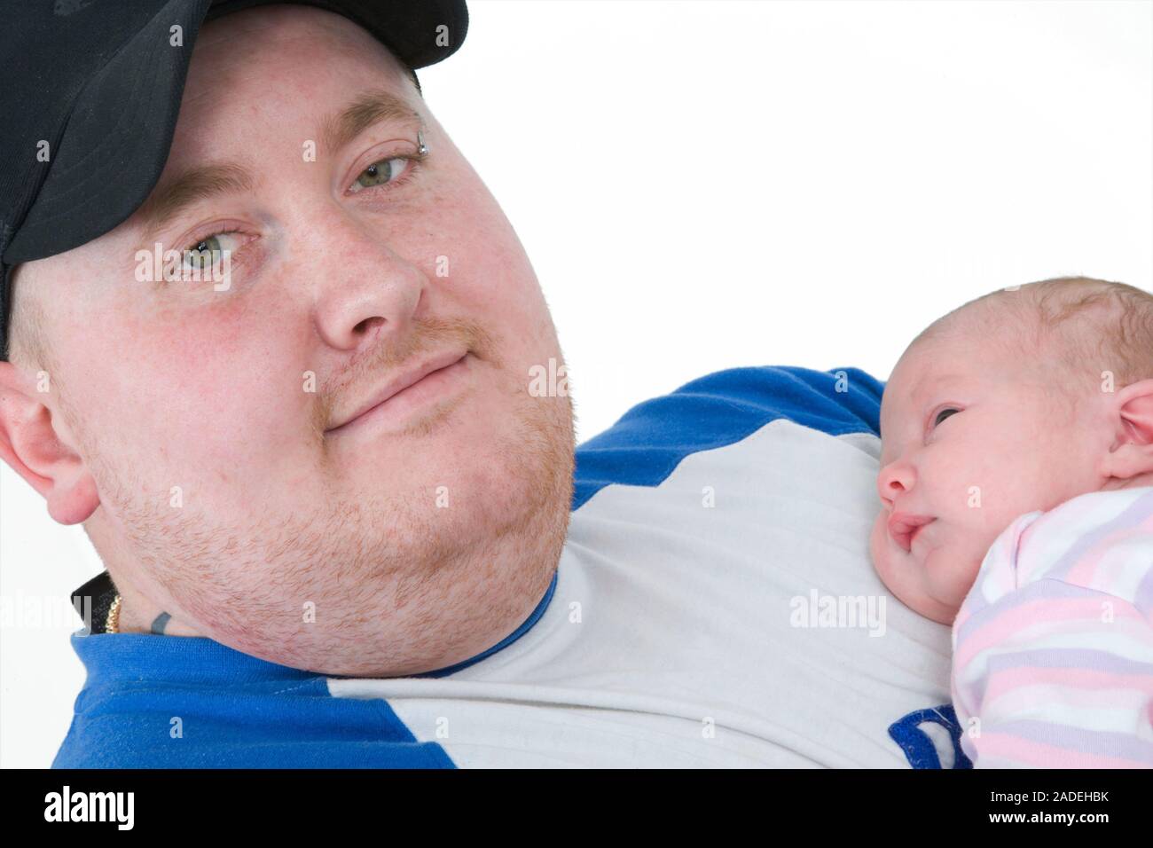 Portrait of a man with his newborn baby Stock Photo - Alamy