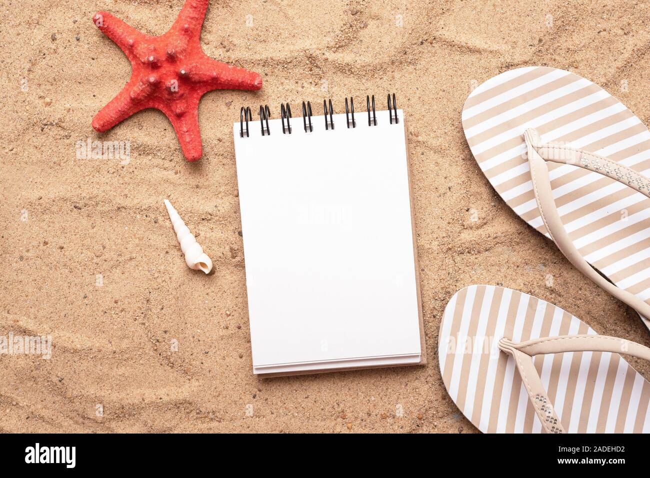 Notepad on the sand flat lay background. Sea vacation diary mockup ...