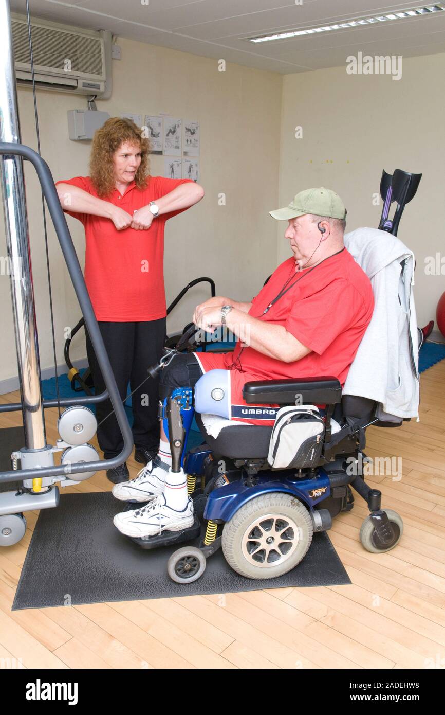 Man with prosthetic limb using pulley machine at a gym Stock Photo - Alamy