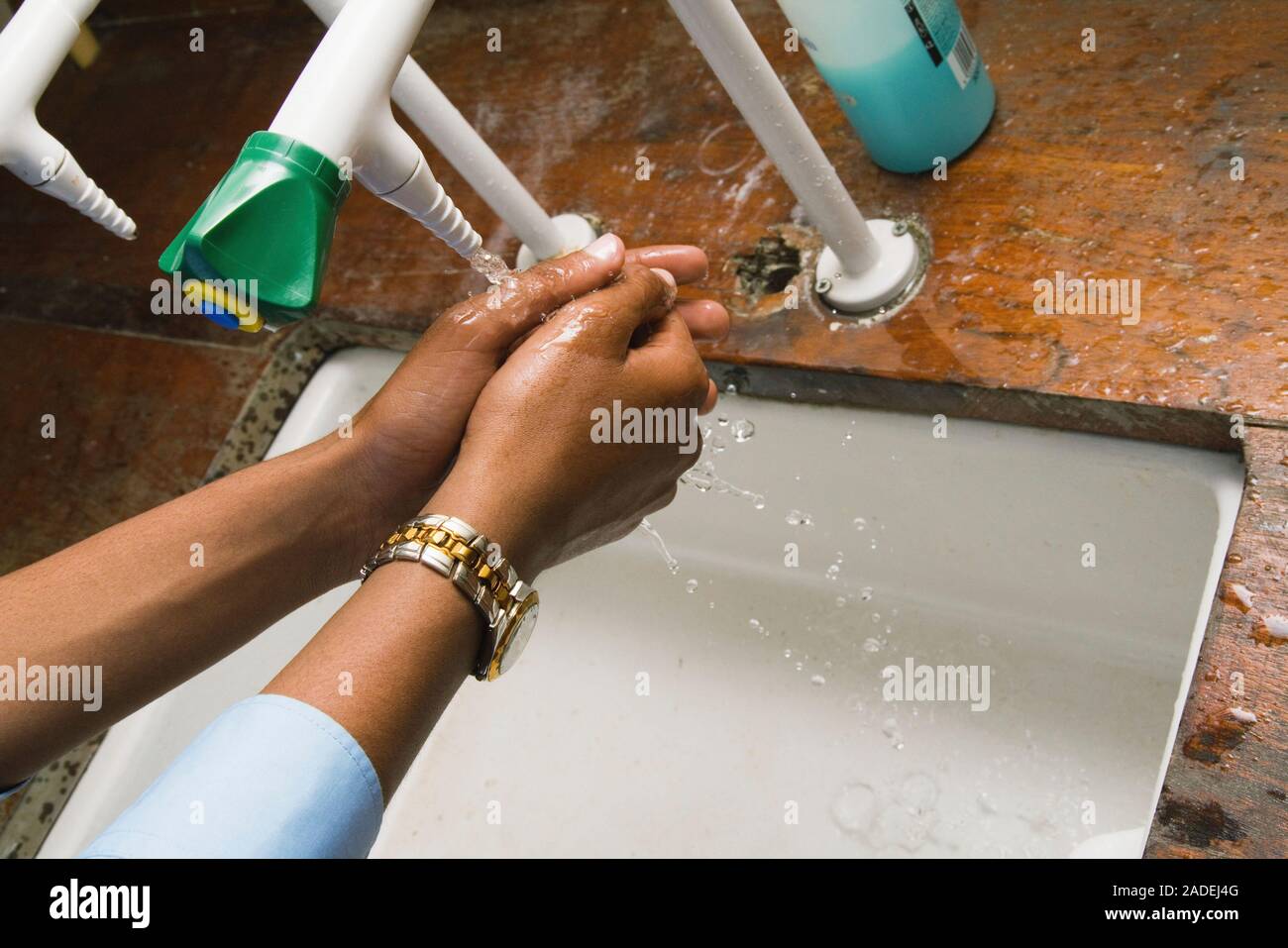 Secondary school student washing their hands in a science lesson Stock ...