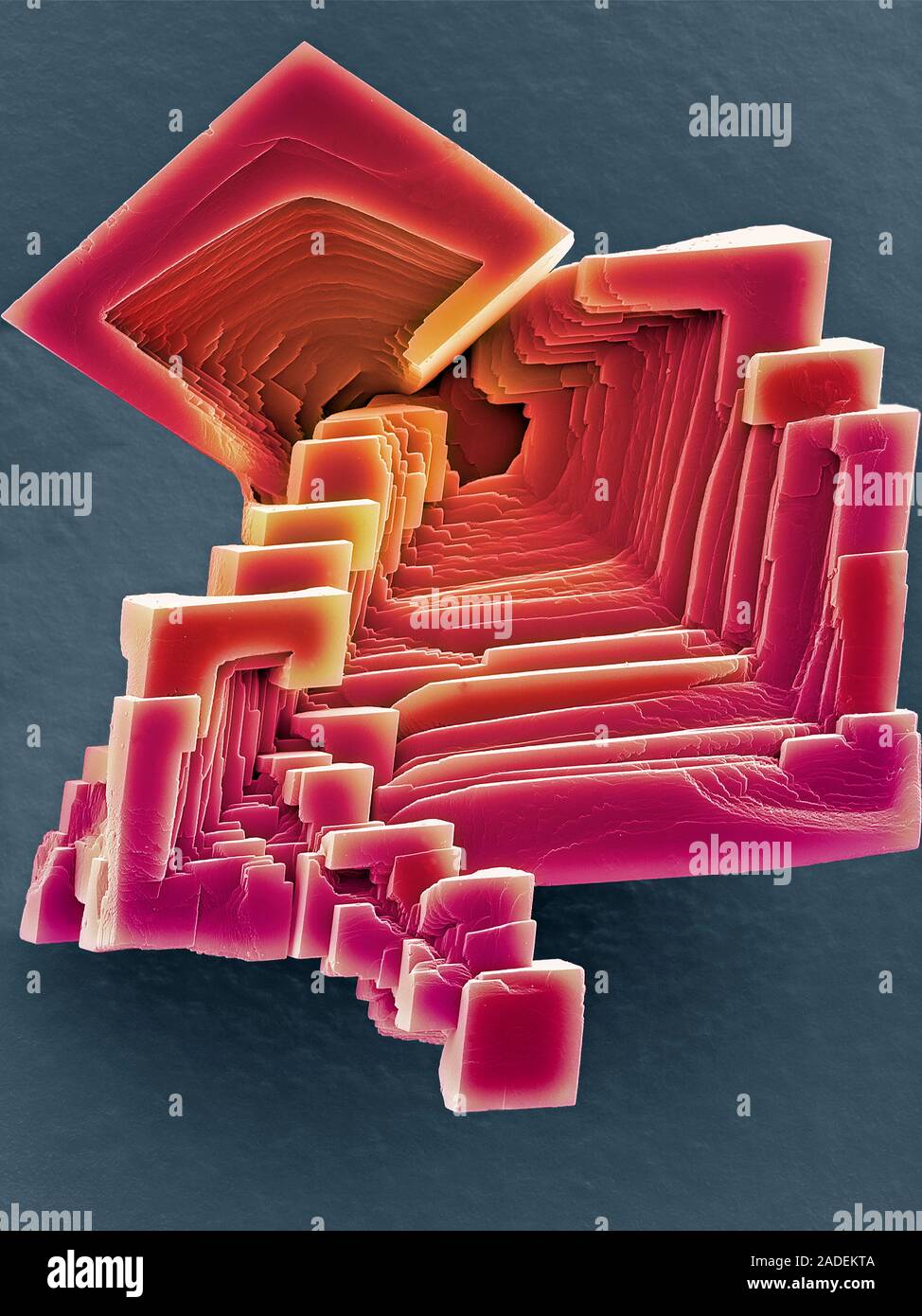 Calcite crystals. Coloured scanning electron micrograph (SEM) of ...