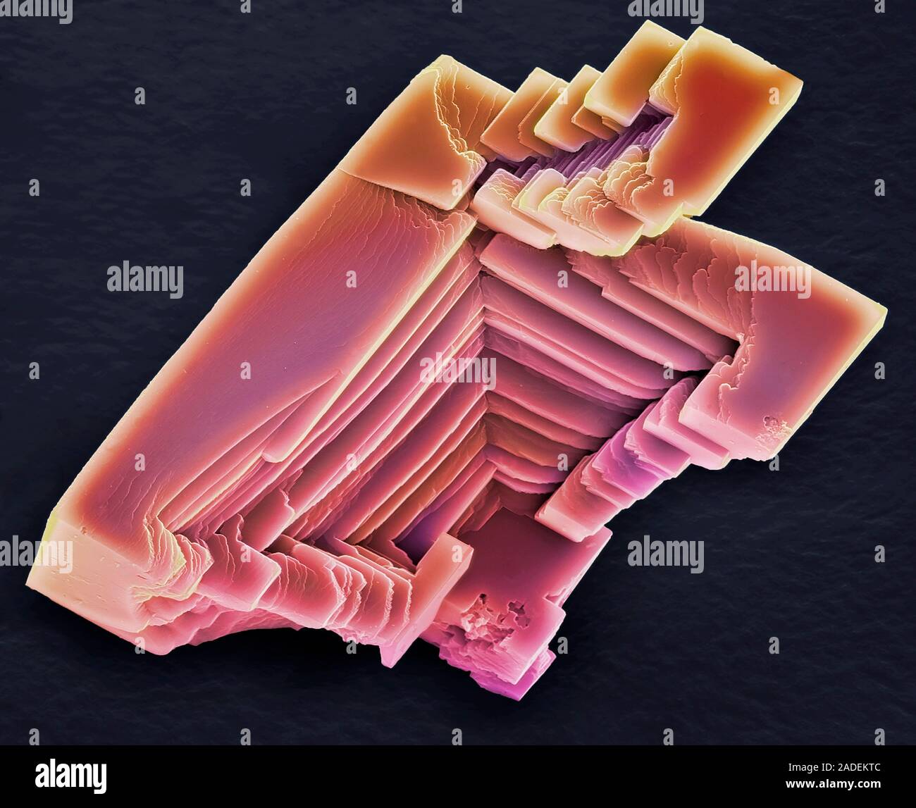 Calcite crystals. Coloured scanning electron micrograph (SEM) of ...