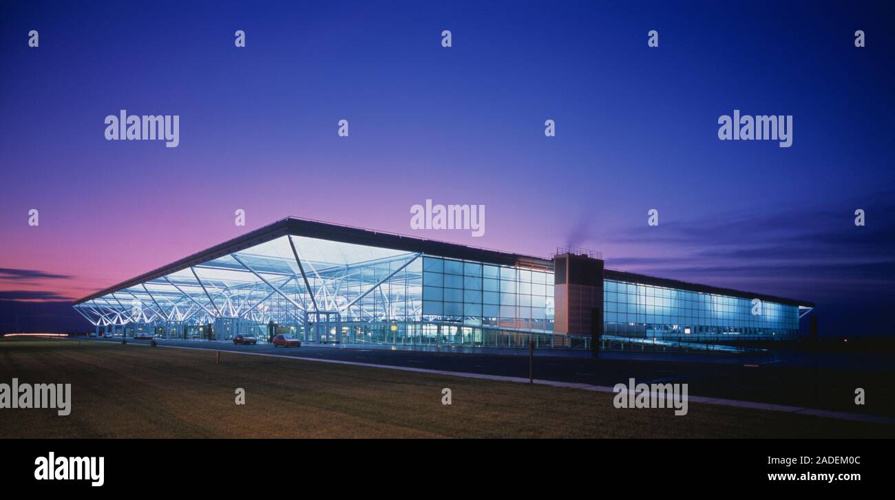 London Stansted Airport terminal at dusk. Construction of this terminal ...