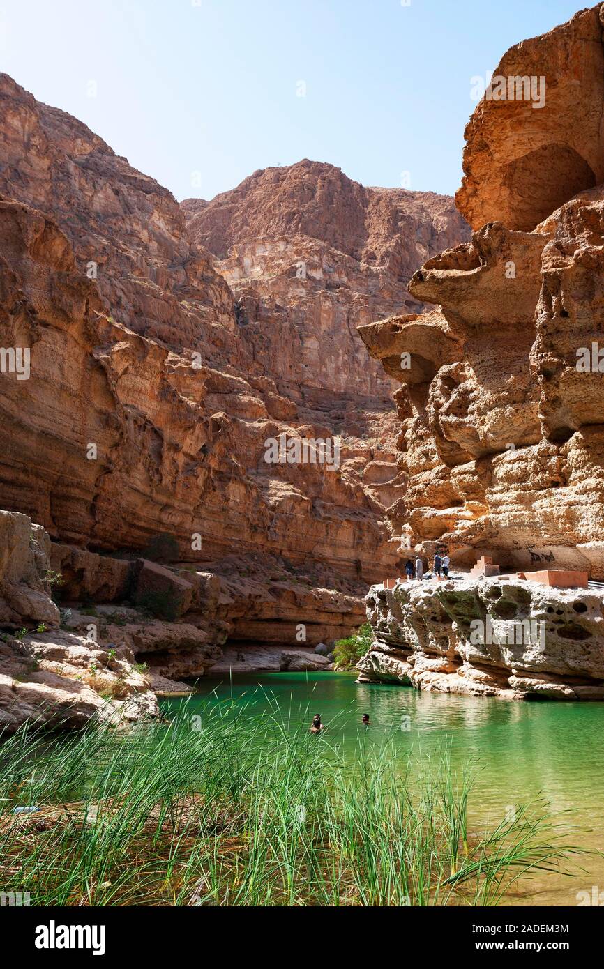 Freshwater pool between rugged cliffs, Wadi Shab, Shamal ash district ...