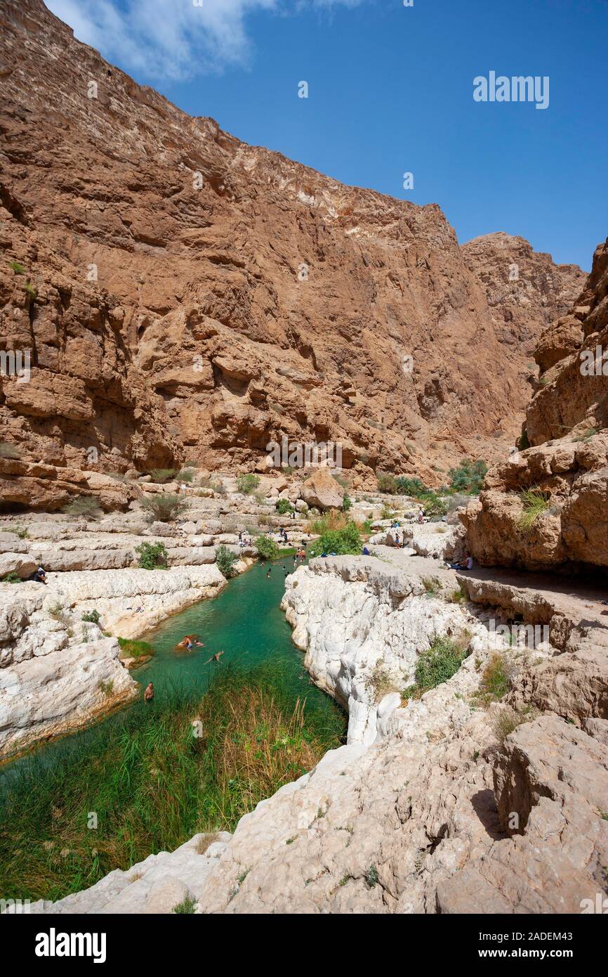 Freshwater pool between rugged cliffs, Wadi Shab, Shamal ash district ...