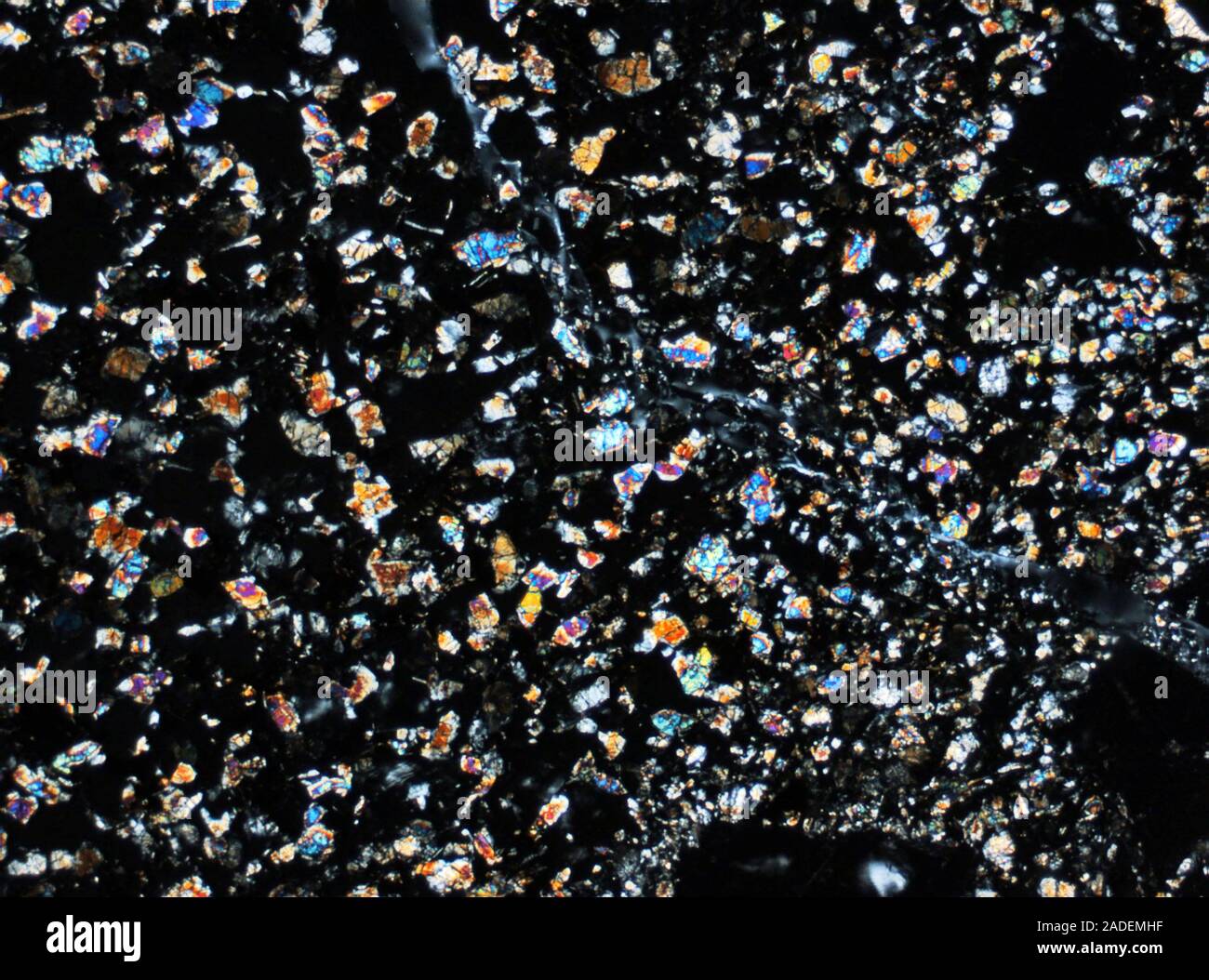 Lunar impact melt breccia. Polarised light micrograph of a thin section ...
