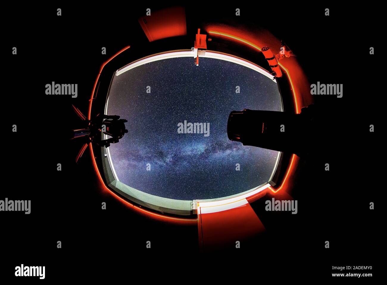 Observatory telescopes with the Milky Way in the night sky seen through ...