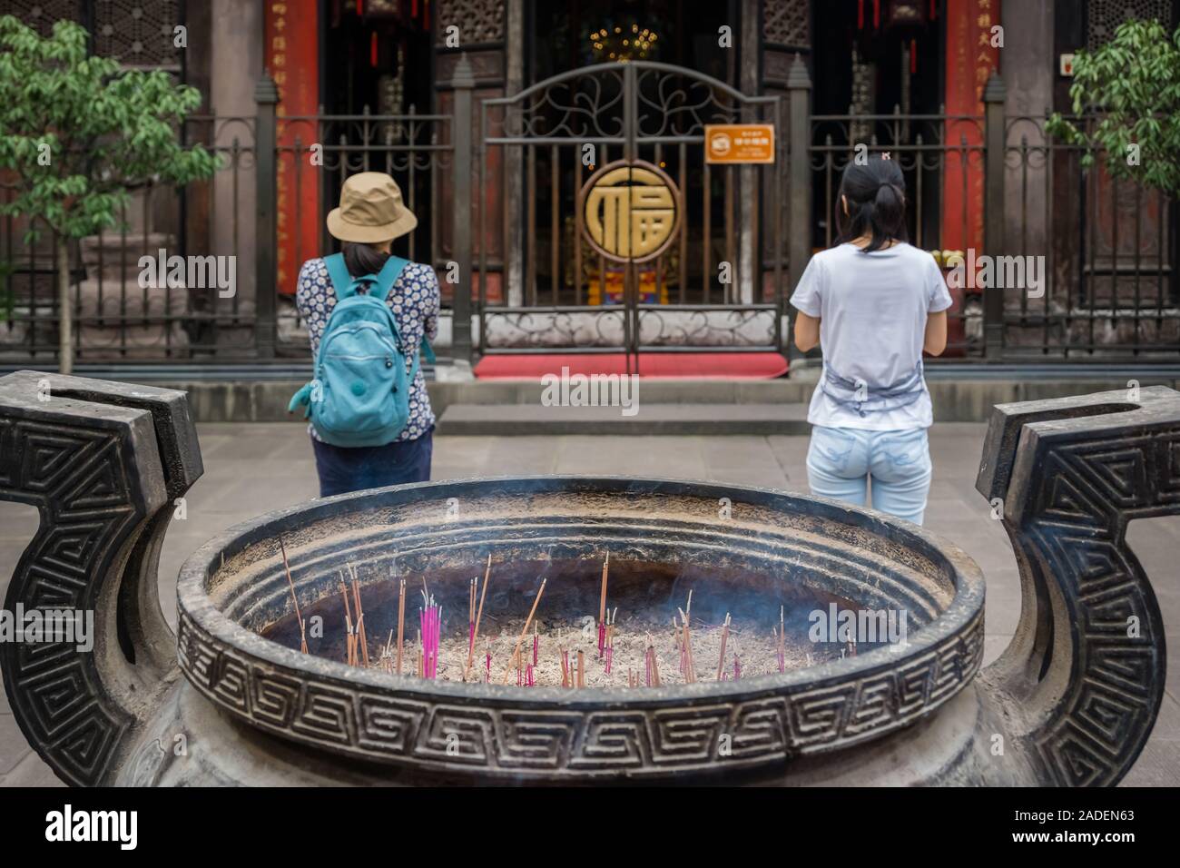Chengdu, China - July 2019 : Chinese woman and man praying, worshiping ...