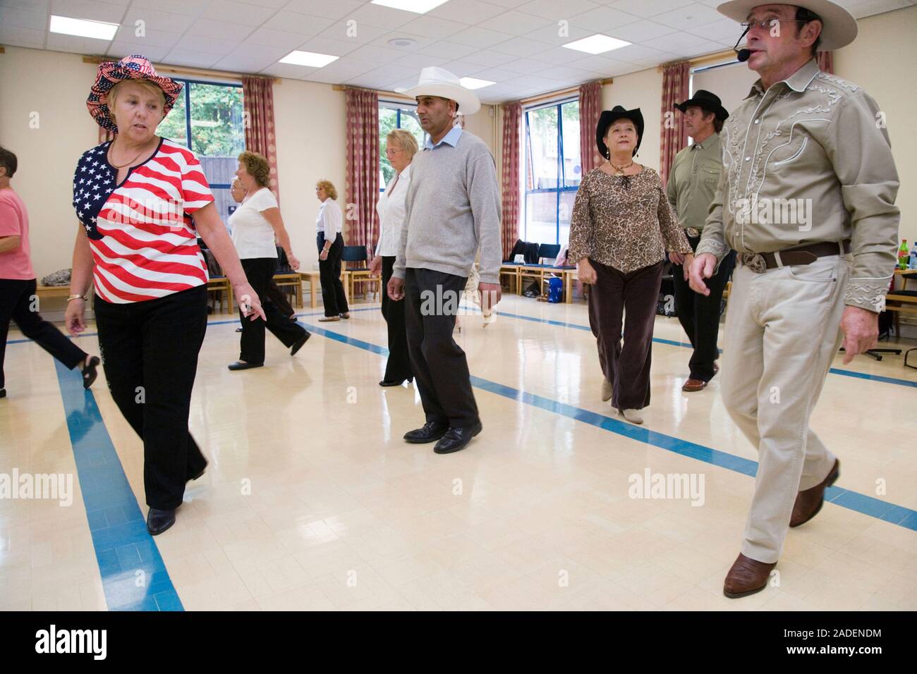 Group of older people line dancing Stock Photo - Alamy
