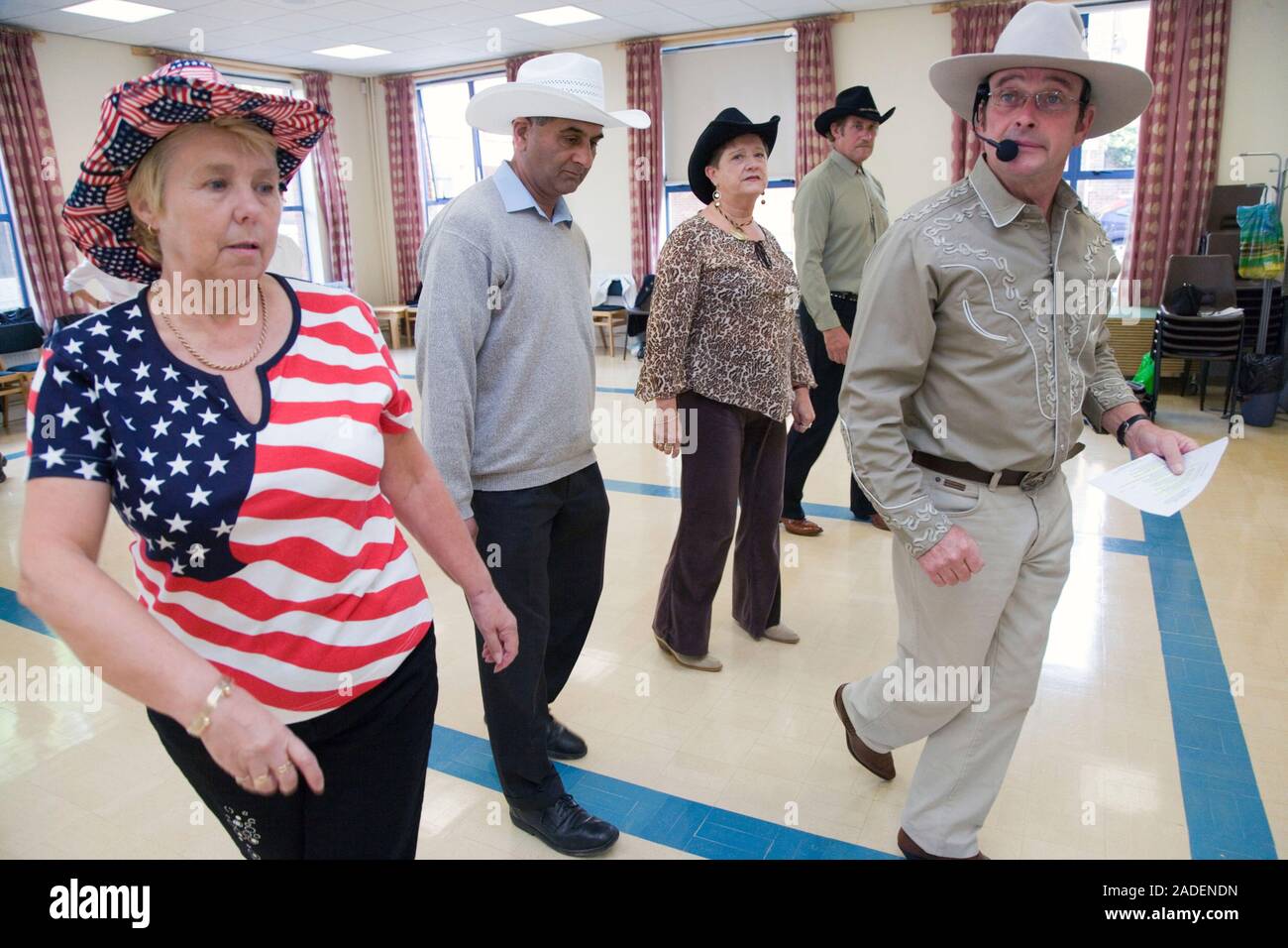 Group of older people line dancing Stock Photo - Alamy