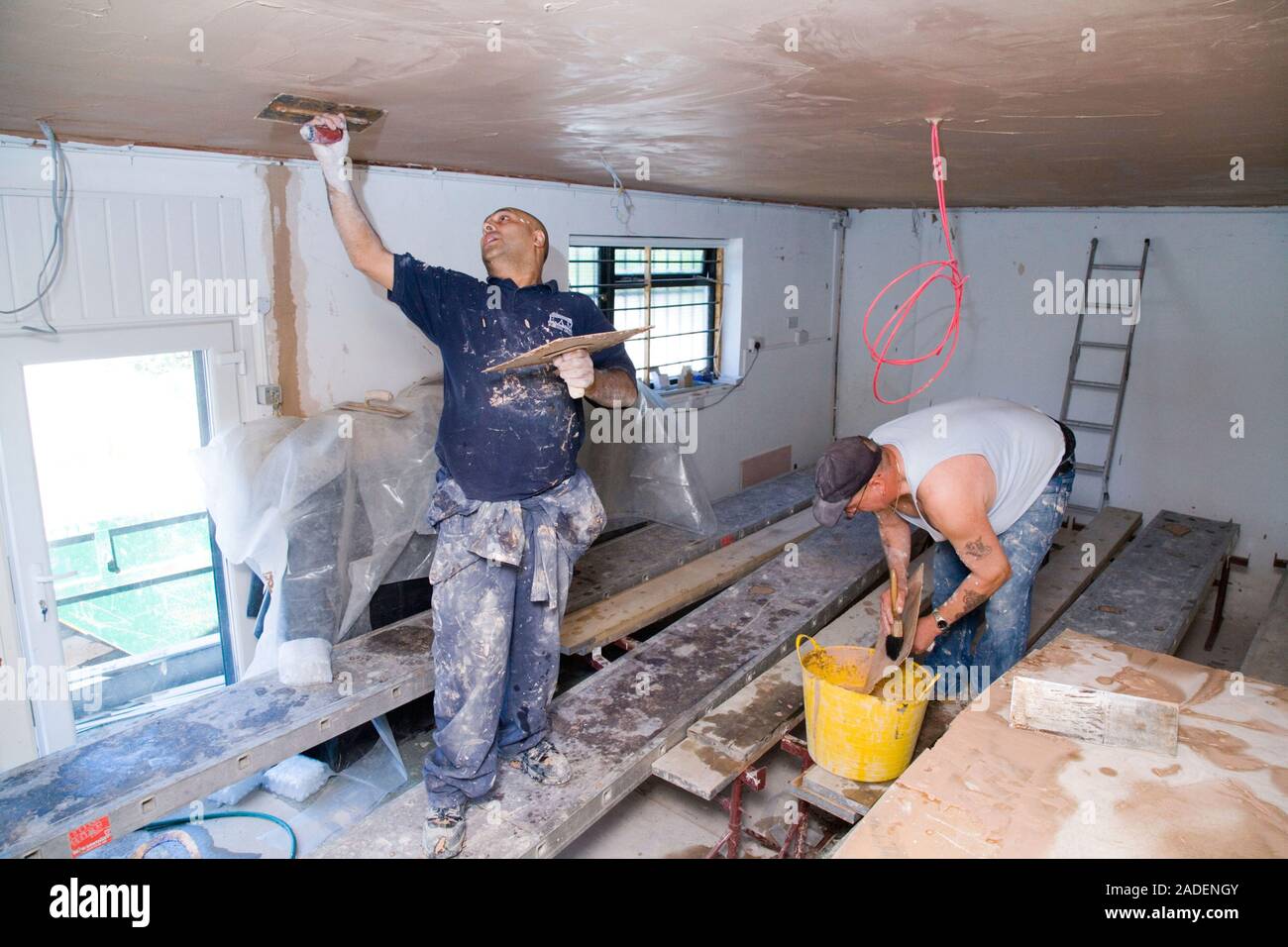 Men plastering the ceiling Stock Photo - Alamy