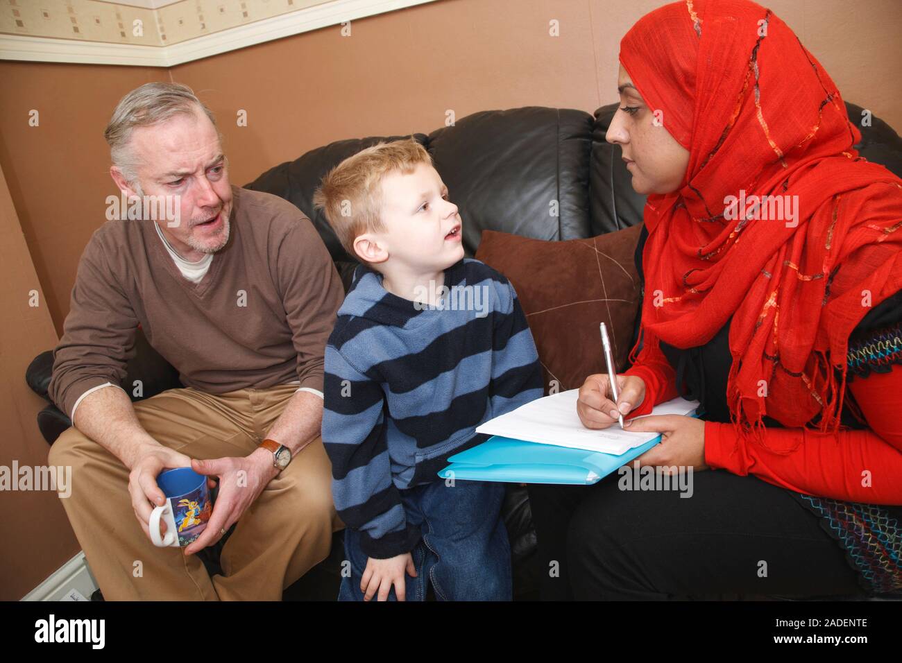 Professional visiting family at home Stock Photo - Alamy