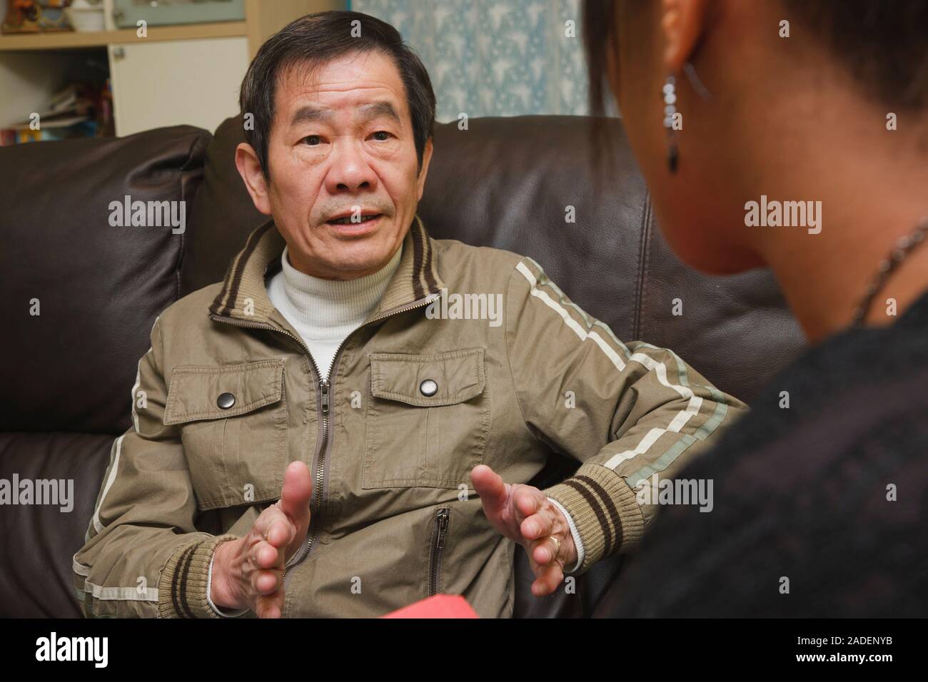 Professional interviewing Chinese man Stock Photo - Alamy