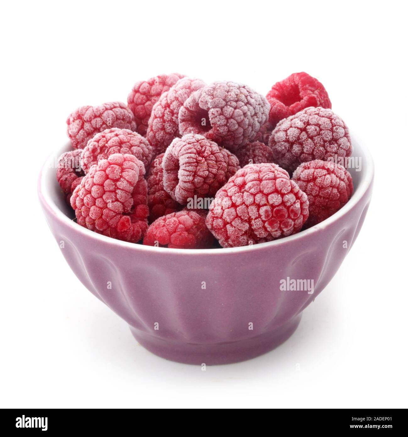 Frozen Raspberries In A Bowl Isolated On White Stock Photo - Alamy