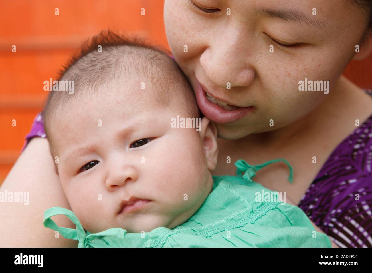 Chinese mother with baby Stock Photo - Alamy