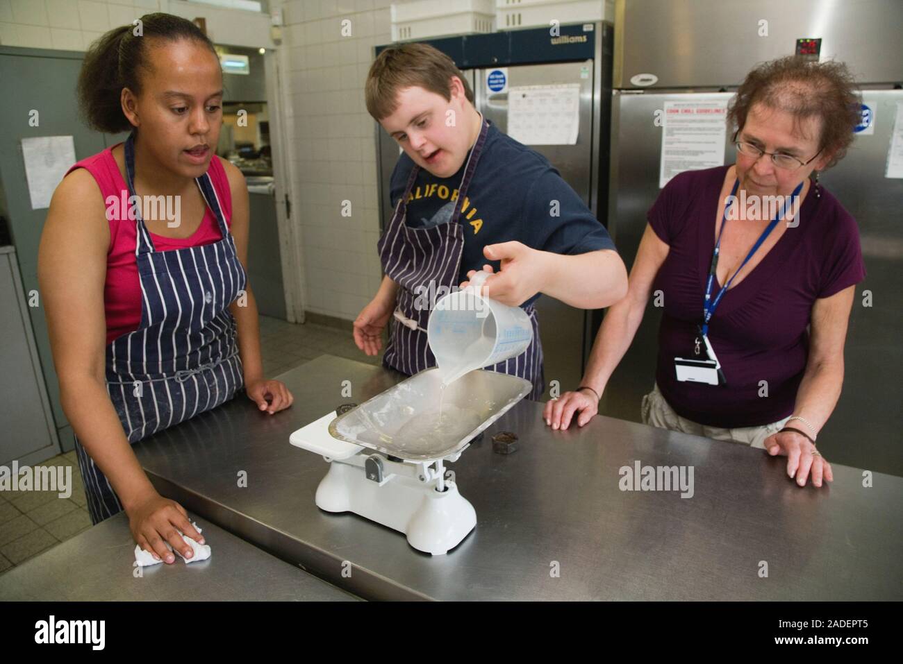 Students with learning disabilities learning to cook in lesson at ...