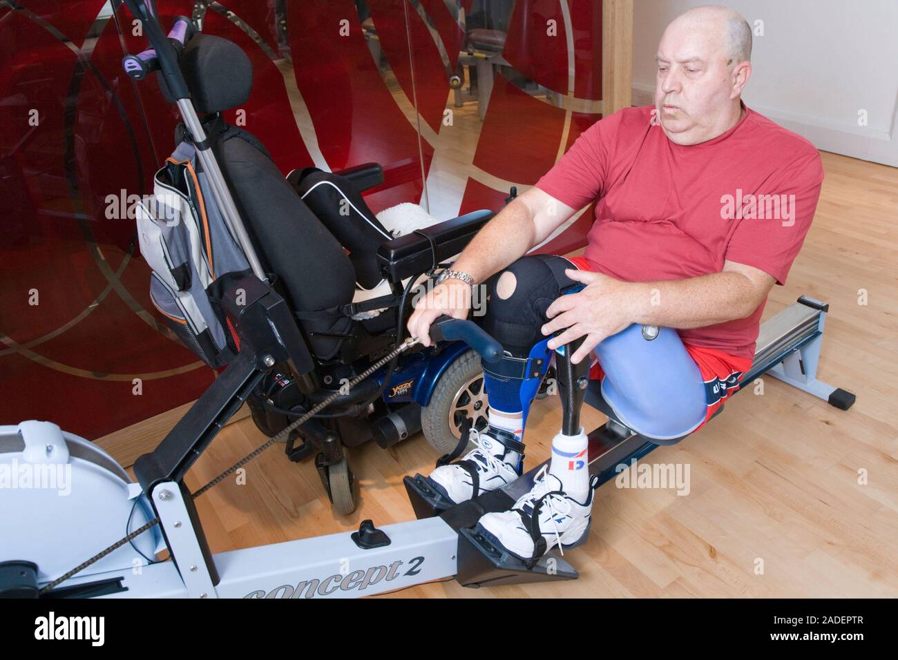Man with prosthetic limb using a rowing machine at the gym Stock Photo ...