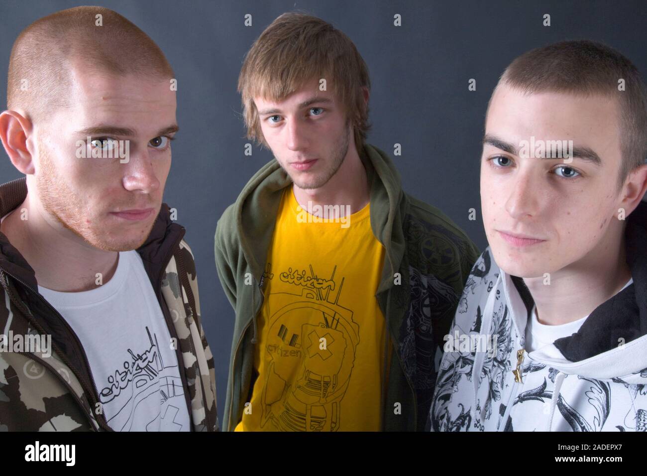 Studio portrait of three young men, with attitude Stock Photo - Alamy