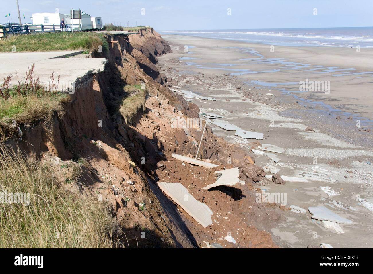 Concrete caravan bases on beach having fallen down eroded cliffs at ...