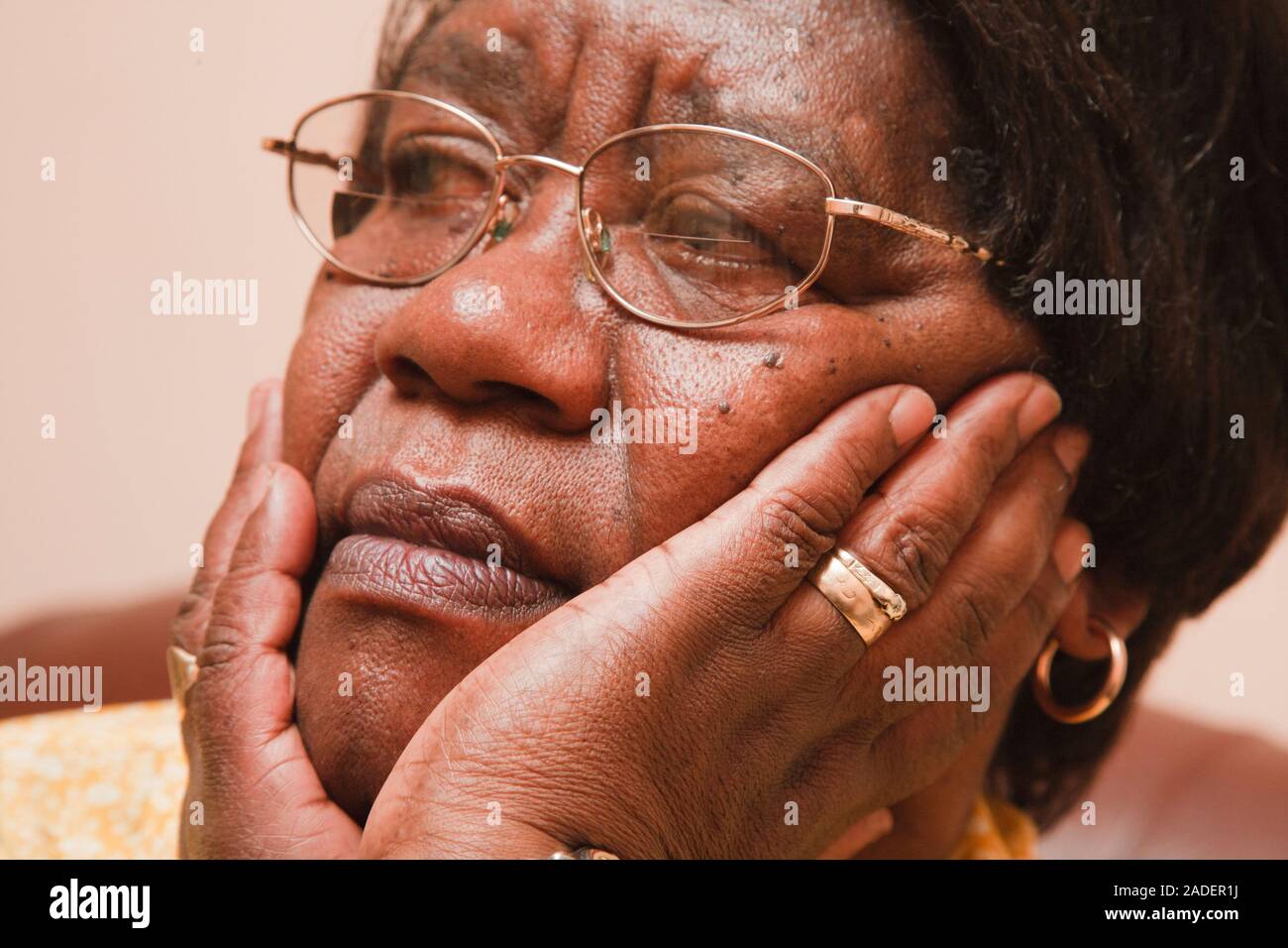 Portrait of old black lady looking thoughtful Stock Photo - Alamy