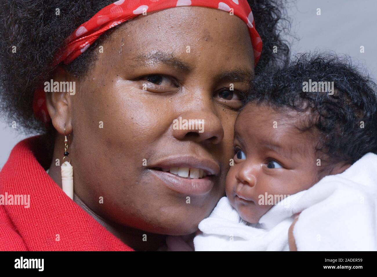New baby, only weeks old, being held by her happy mother Stock Photo ...