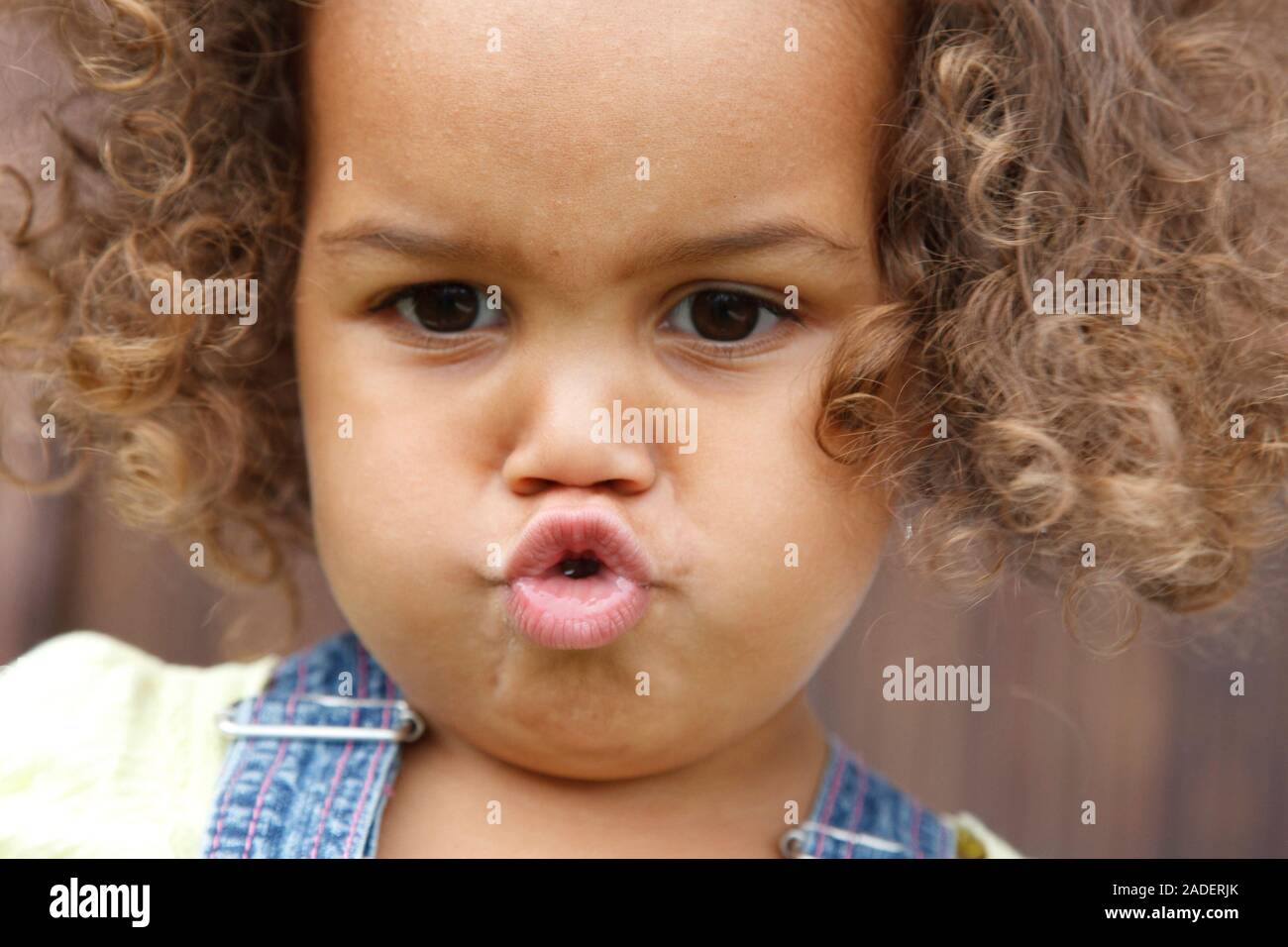 Little girl making a face Stock Photo - Alamy