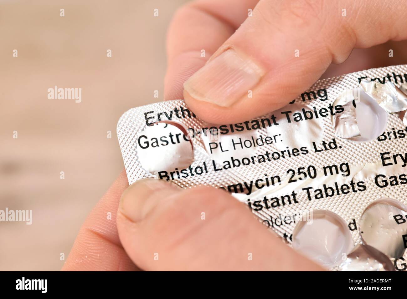 MODEL RELEASED. Erythromycin antibiotic drug being dispensed from a ...